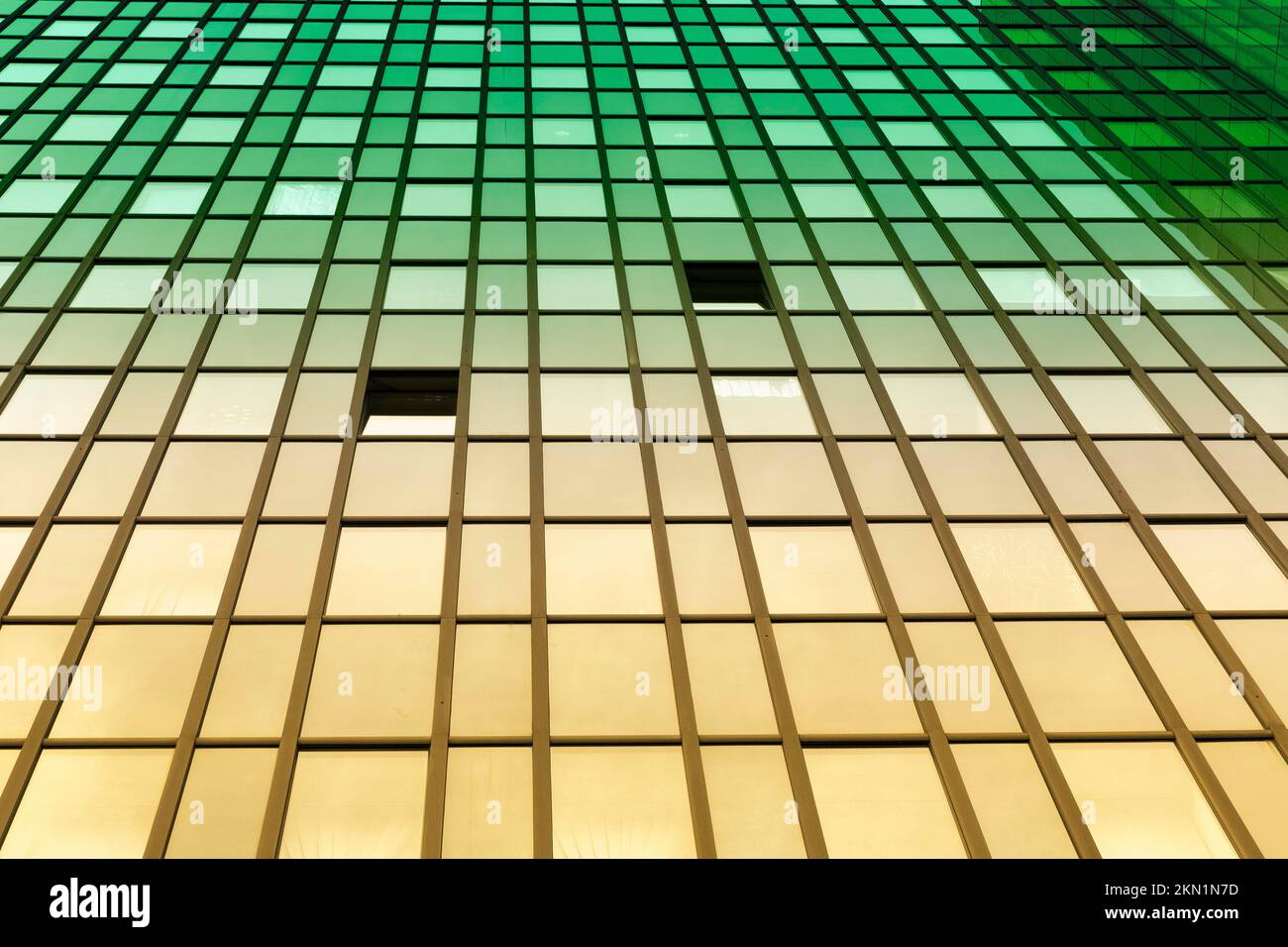 Glass facade of an office tower with two open windows, view upwards ...