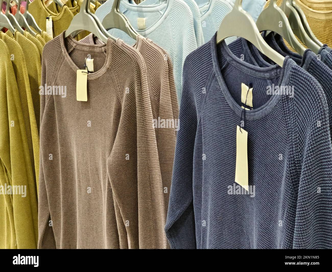 Indian men's latest fashion dress hung on hangers, in a retail store in ...