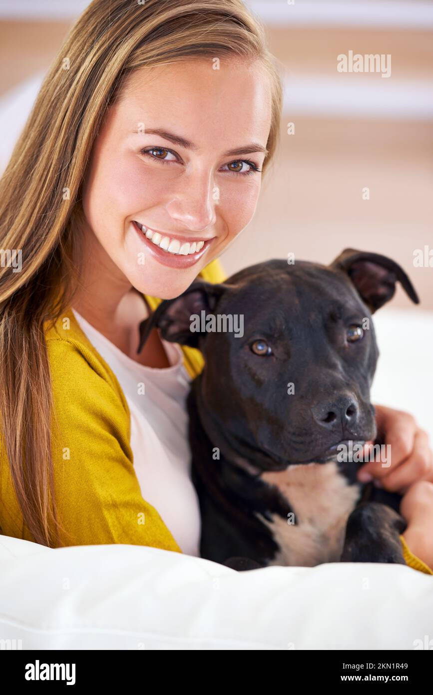 I love him so much. Portrait of an attractive young woman cuddling with ...