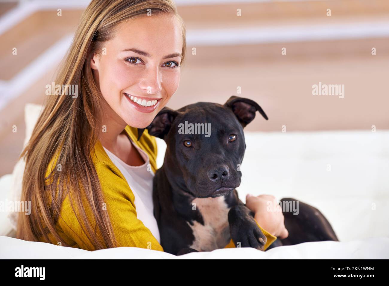 Hes s loyal. Portrait of an attractive young woman cuddling with her ...
