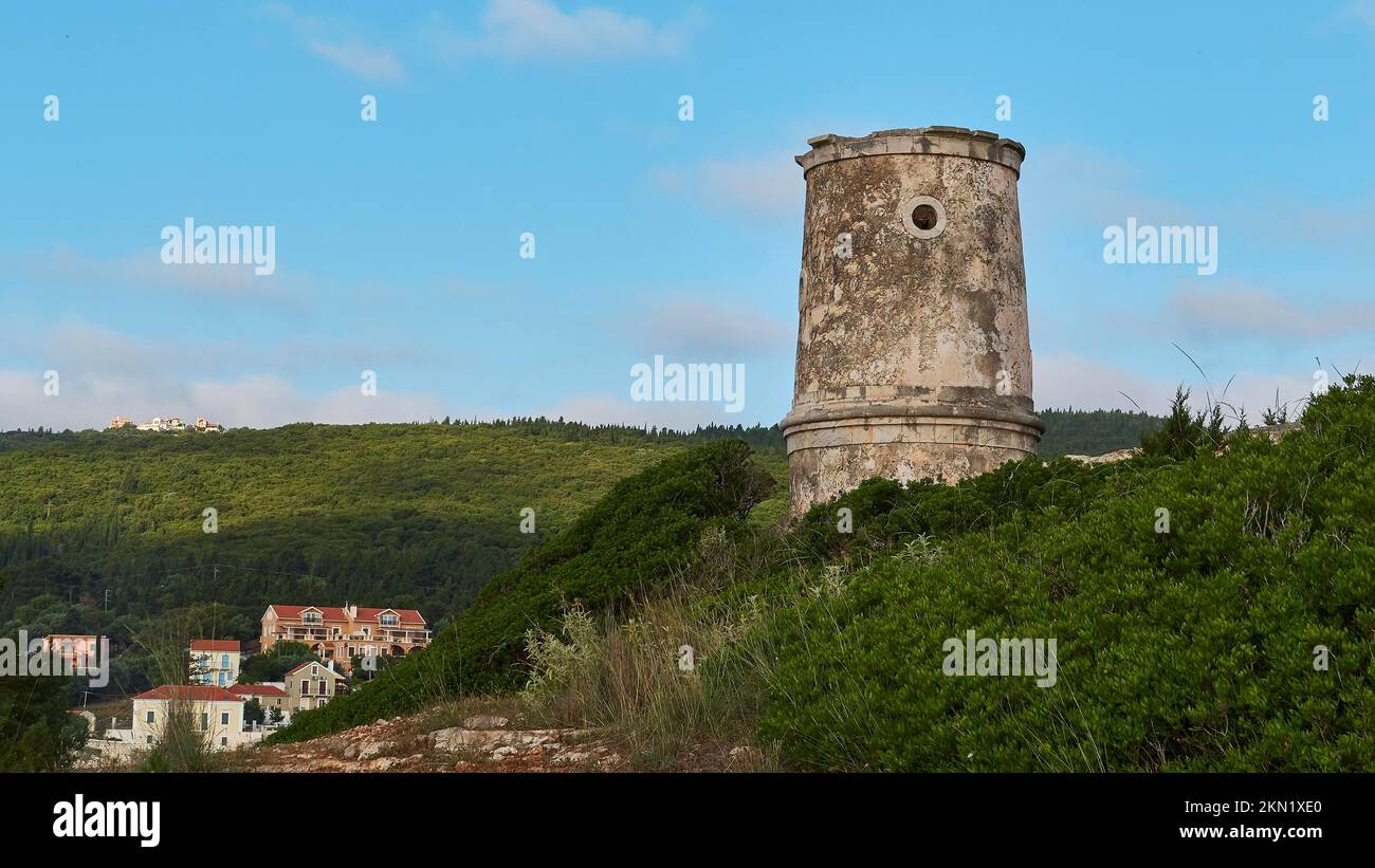 Round Venetian lighthouse, houses, green hill, forest, harbour village ...