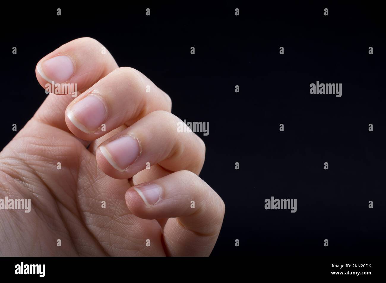 Four fingers of a child hand partly seen in black background Stock ...