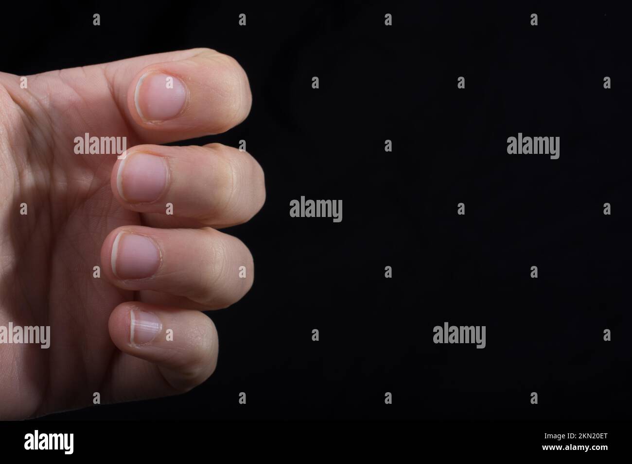 Four fingers of a child hand partly seen in black background Stock ...