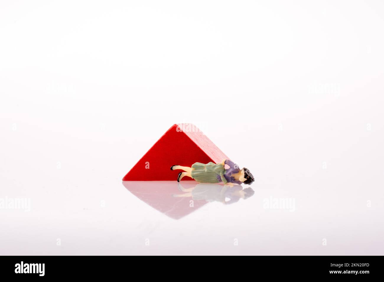 Woman figure near a color block on a white background Stock Photo - Alamy