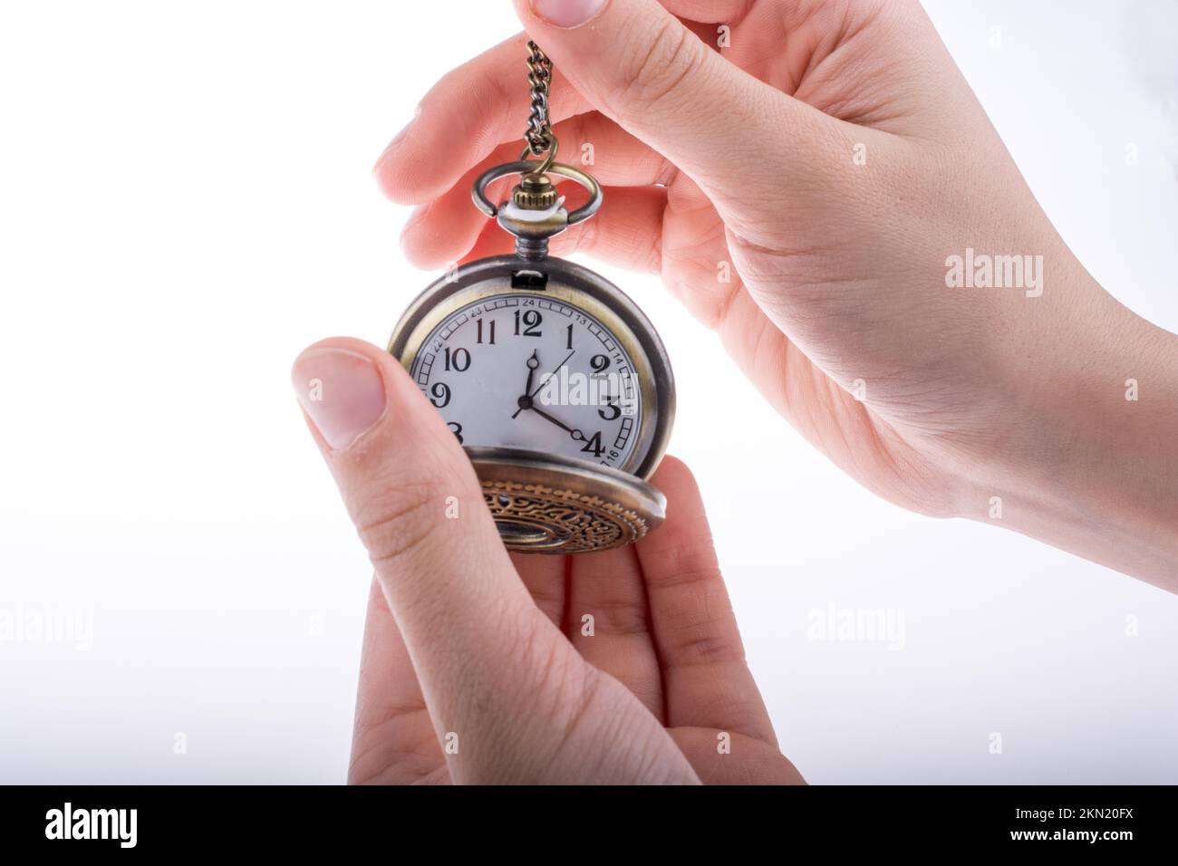 Hand holding a retro styled pocket watch in hand Stock Photo - Alamy