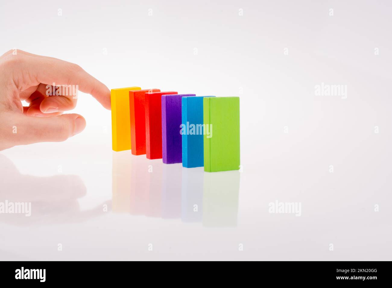 Multi color domino on white background Stock Photo - Alamy