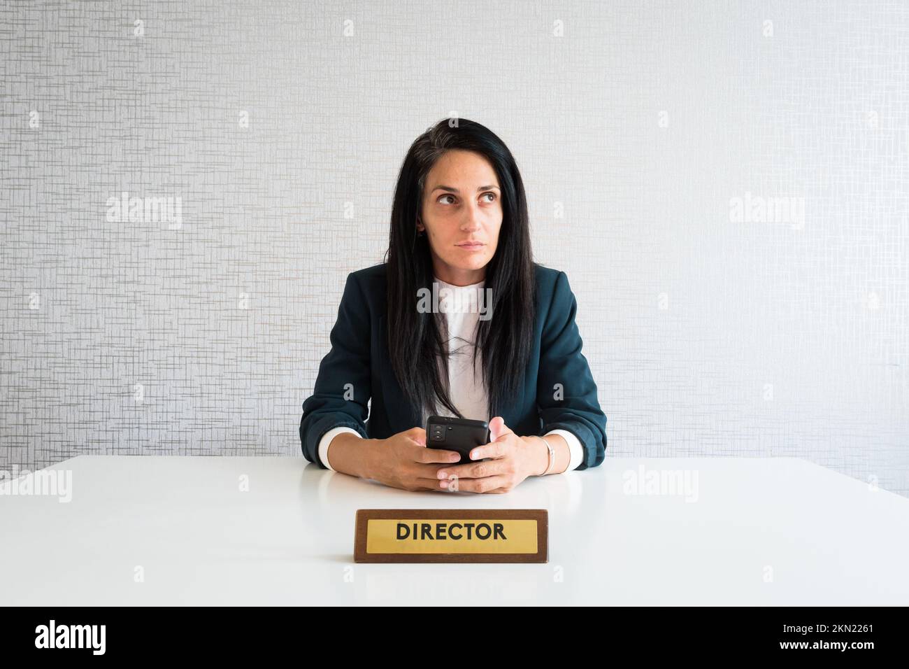 Young caucasian brunette business woman director in office thoughtful ...