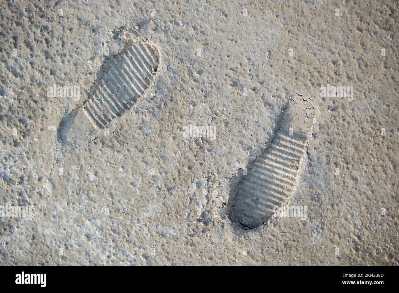 Footstep pattern seen on a concrete background Stock Photo - Alamy