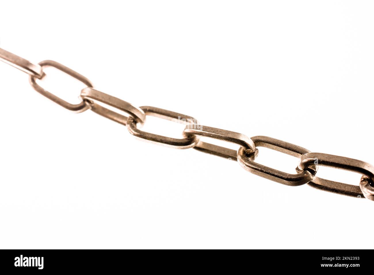 Gold color metal chain on white background Stock Photo - Alamy