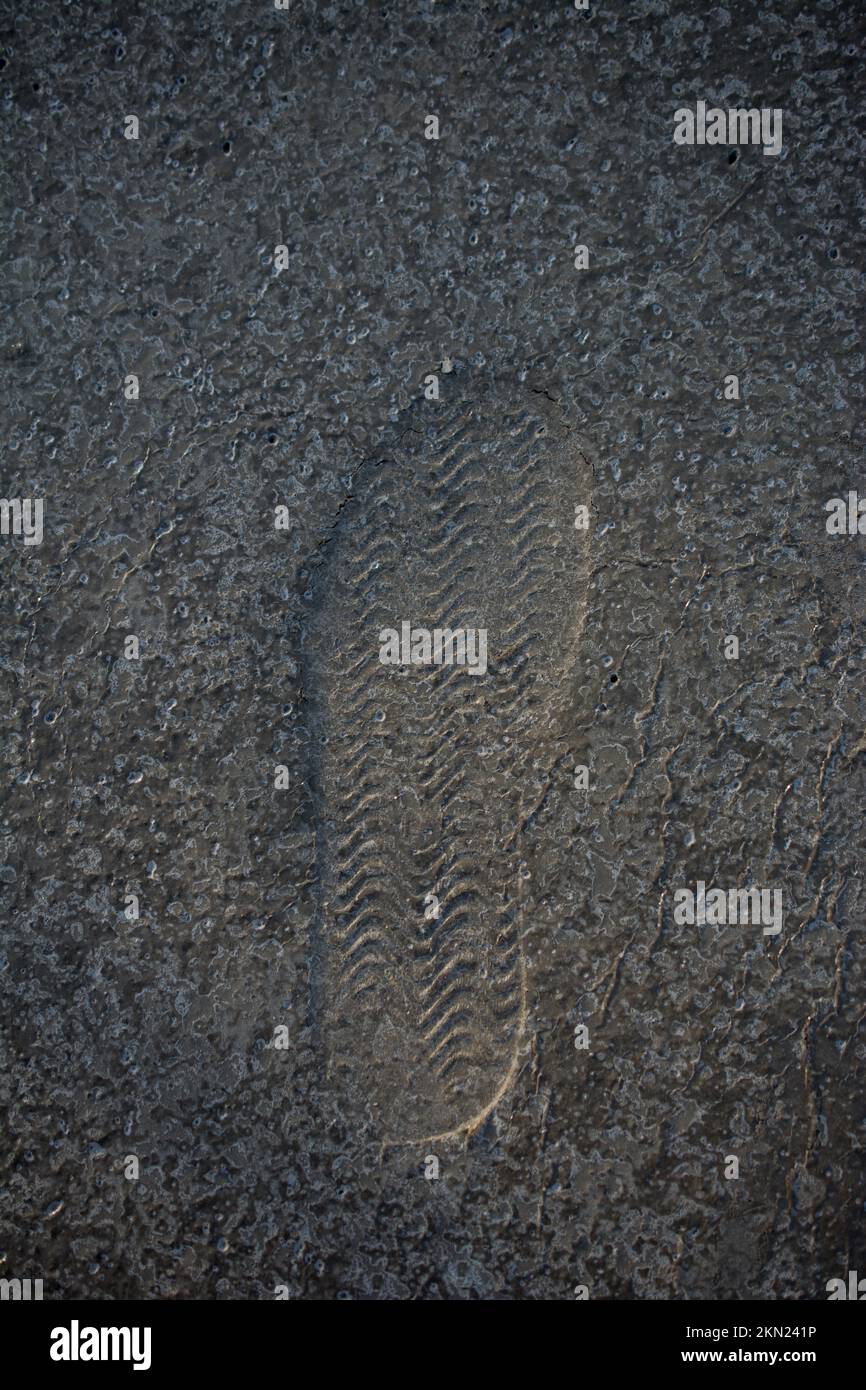 Footstep pattern seen on a concrete background Stock Photo - Alamy