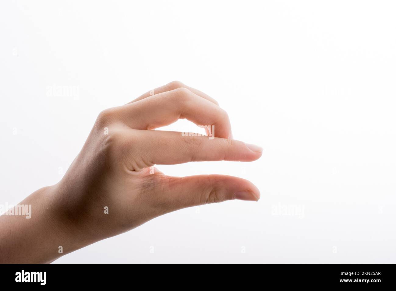 Hand measuring on a white background Stock Photo - Alamy
