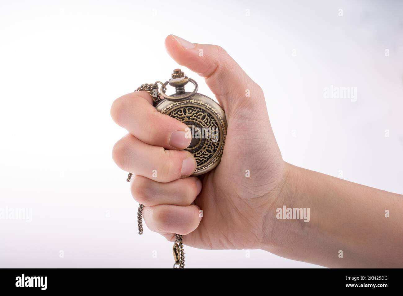 Hand holding a retro styled pocket watch in hand Stock Photo - Alamy