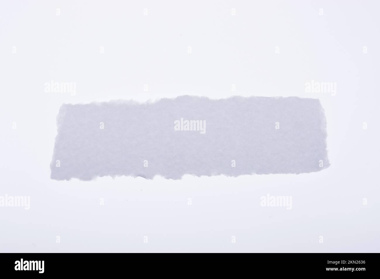 A piece of white blank torn note paper Stock Photo - Alamy