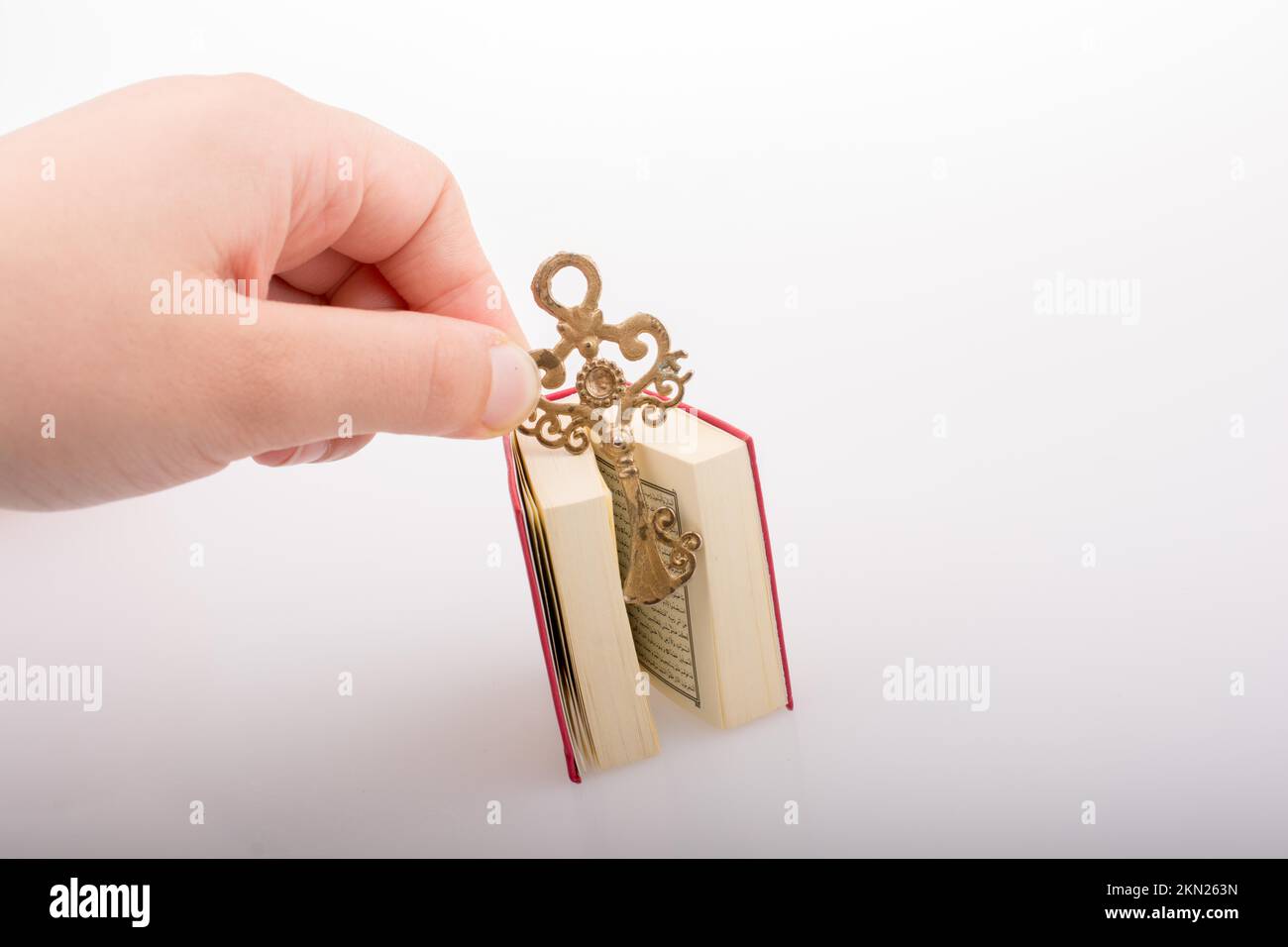 Koran in hand hi-res stock photography and images - Alamy