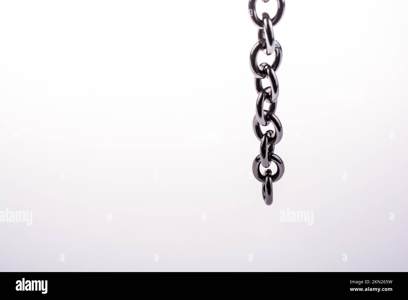 Metal chain on white background Stock Photo - Alamy