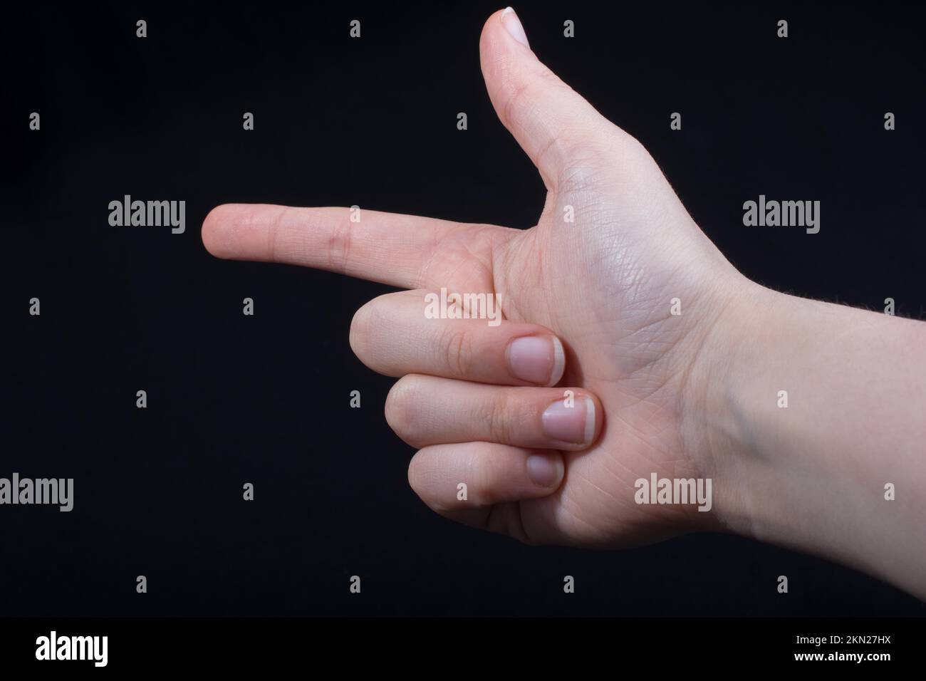 Hand gesture pointing fingers pistol-like handgun on black Stock Photo ...