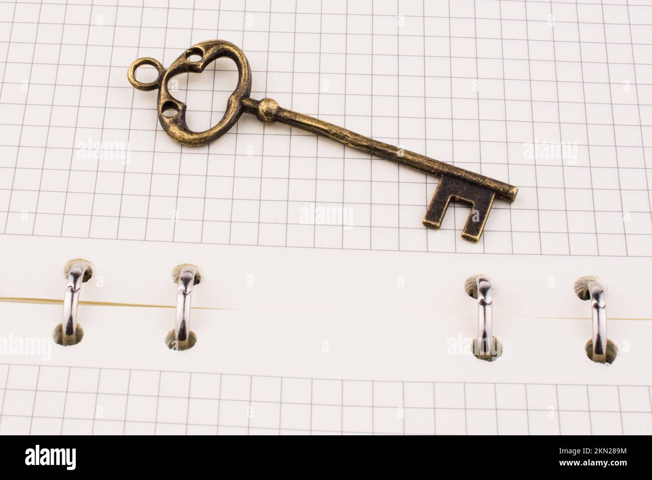 Retro key on a spiral notebook Stock Photo - Alamy