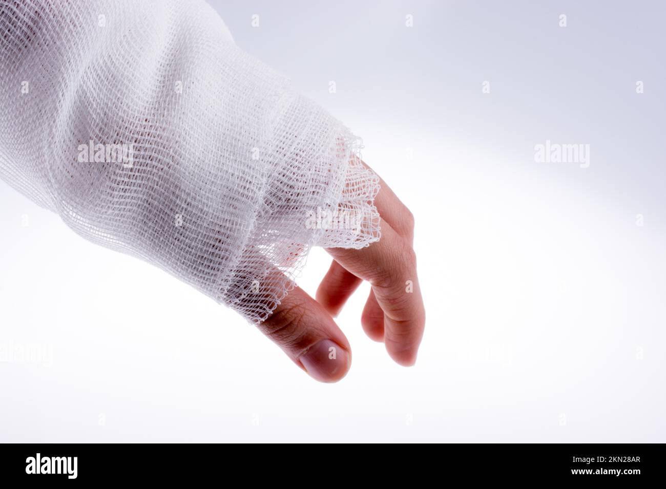 Hand wrapped in white bandage on a white background Stock Photo - Alamy