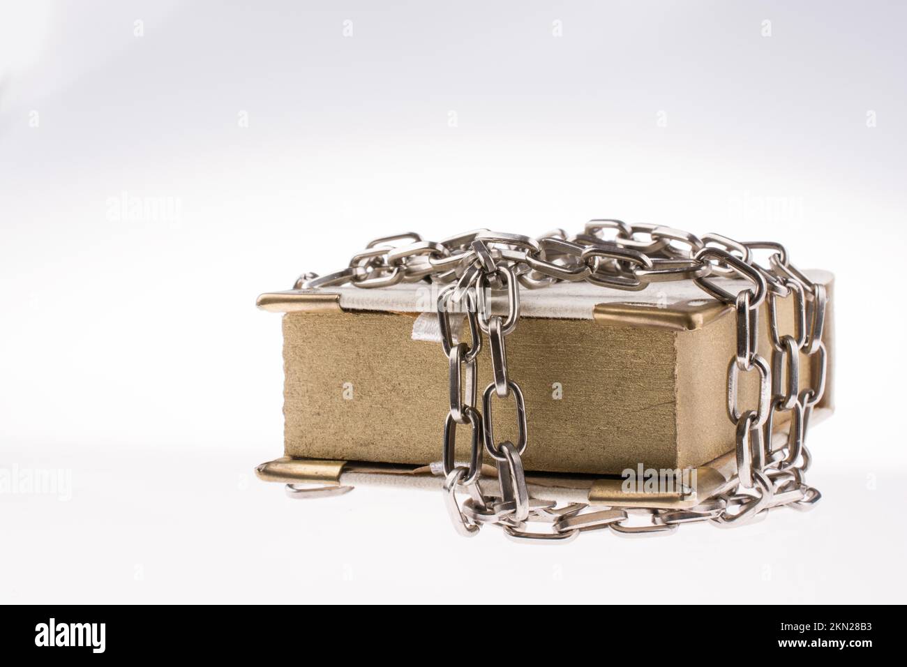 Chained book on white background Stock Photo - Alamy