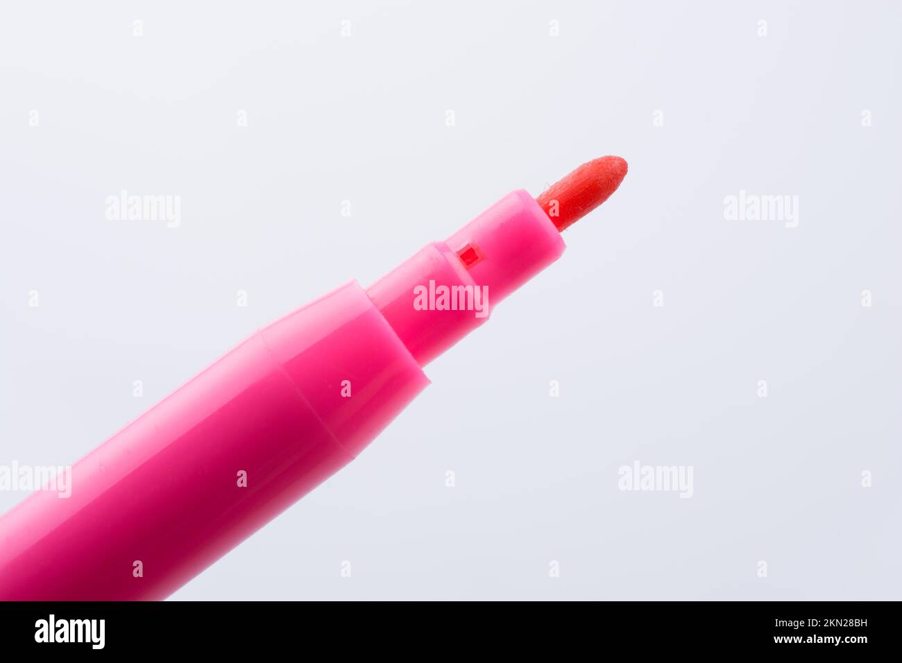 Felt-tip pen of pink color on a white background Stock Photo - Alamy