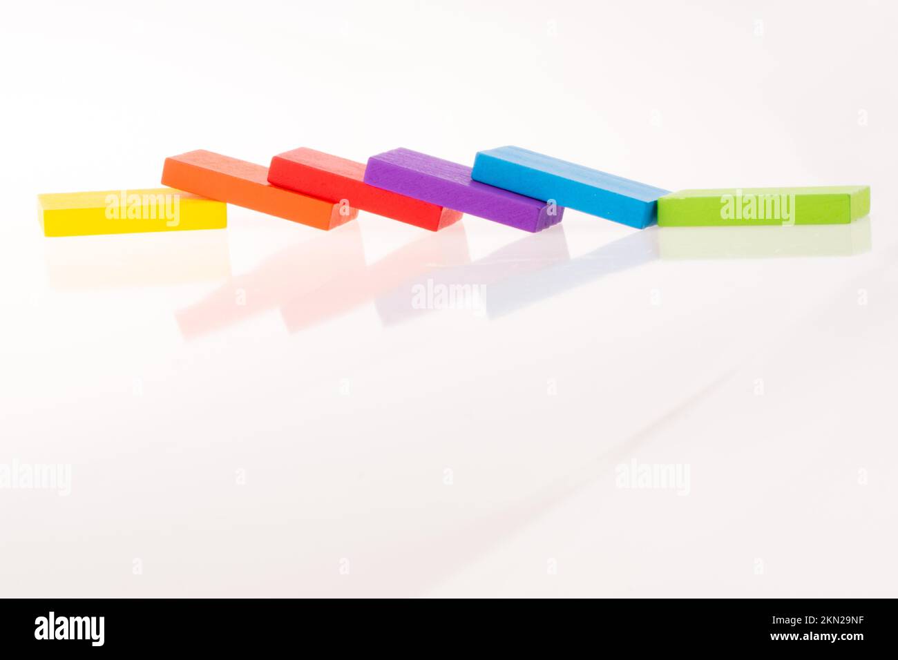 Multi color domino on white background Stock Photo - Alamy