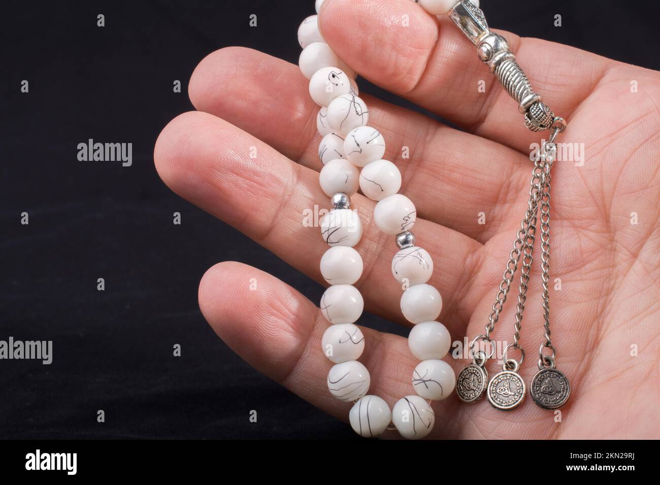 Set of some praying beads of various colors in hand Stock Photo - Alamy