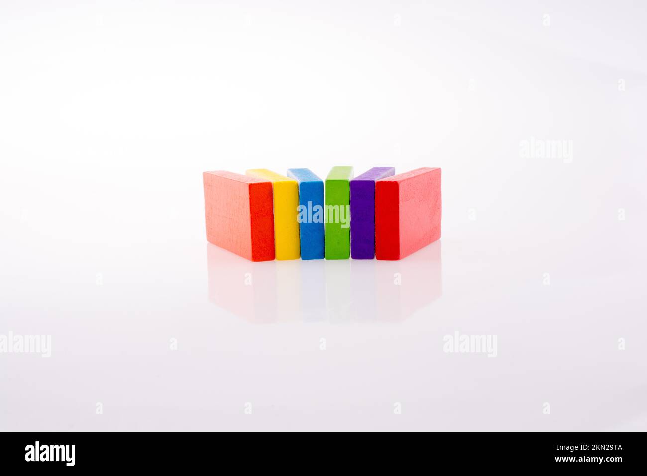 Multi color domino on white background Stock Photo - Alamy