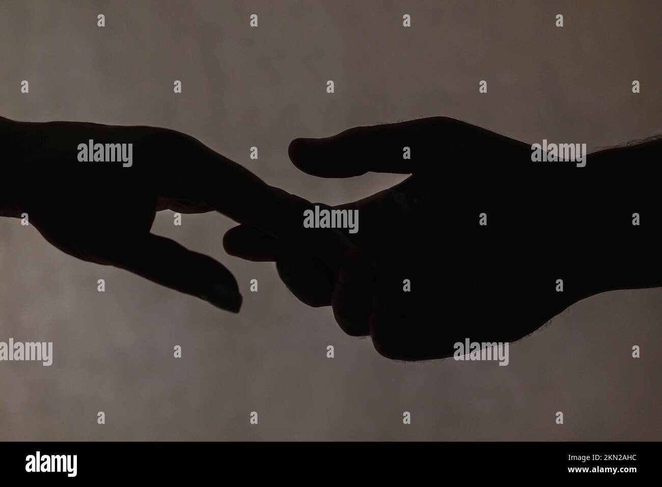 Hands touch silhouette hi-res stock photography and images - Alamy