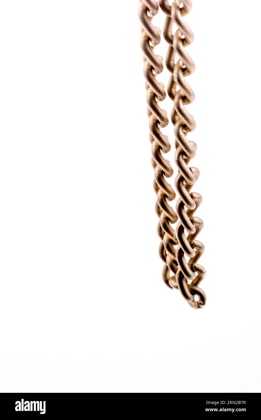 Gold color metal chain on white background Stock Photo - Alamy