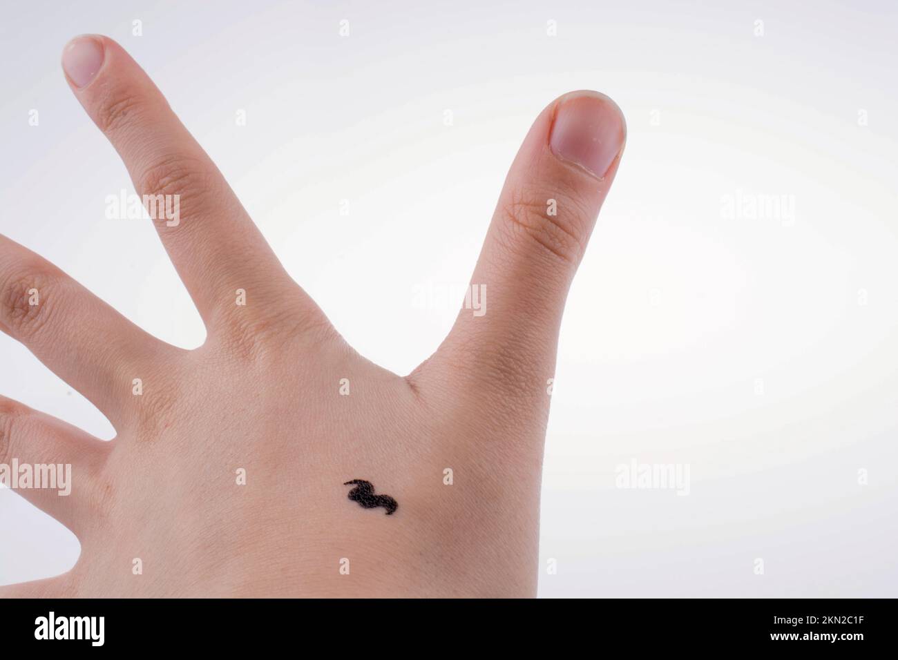 Moustache design on a hand in a white background Stock Photo - Alamy