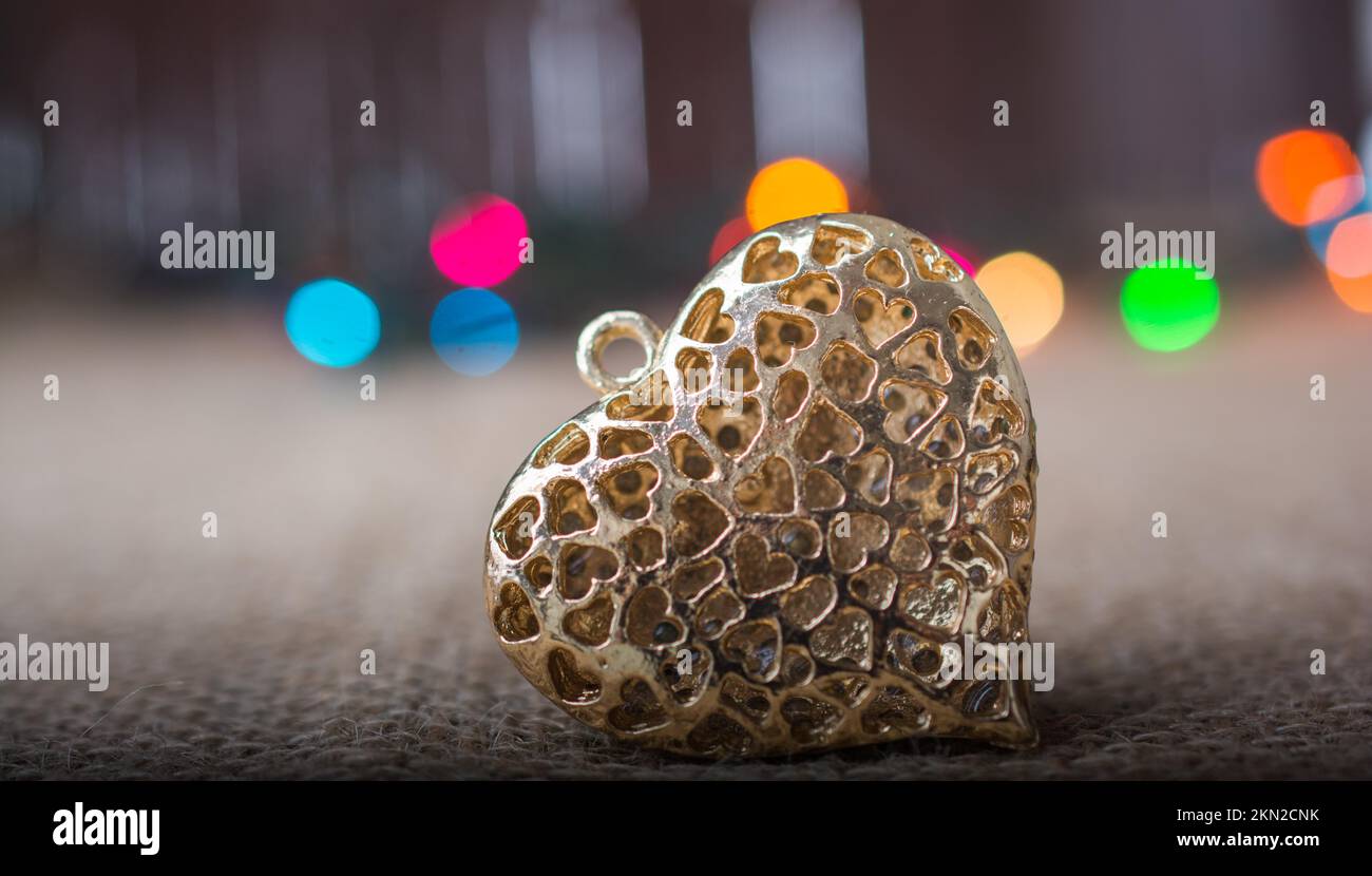 Christmas lights behind heart shaped object Stock Photo - Alamy