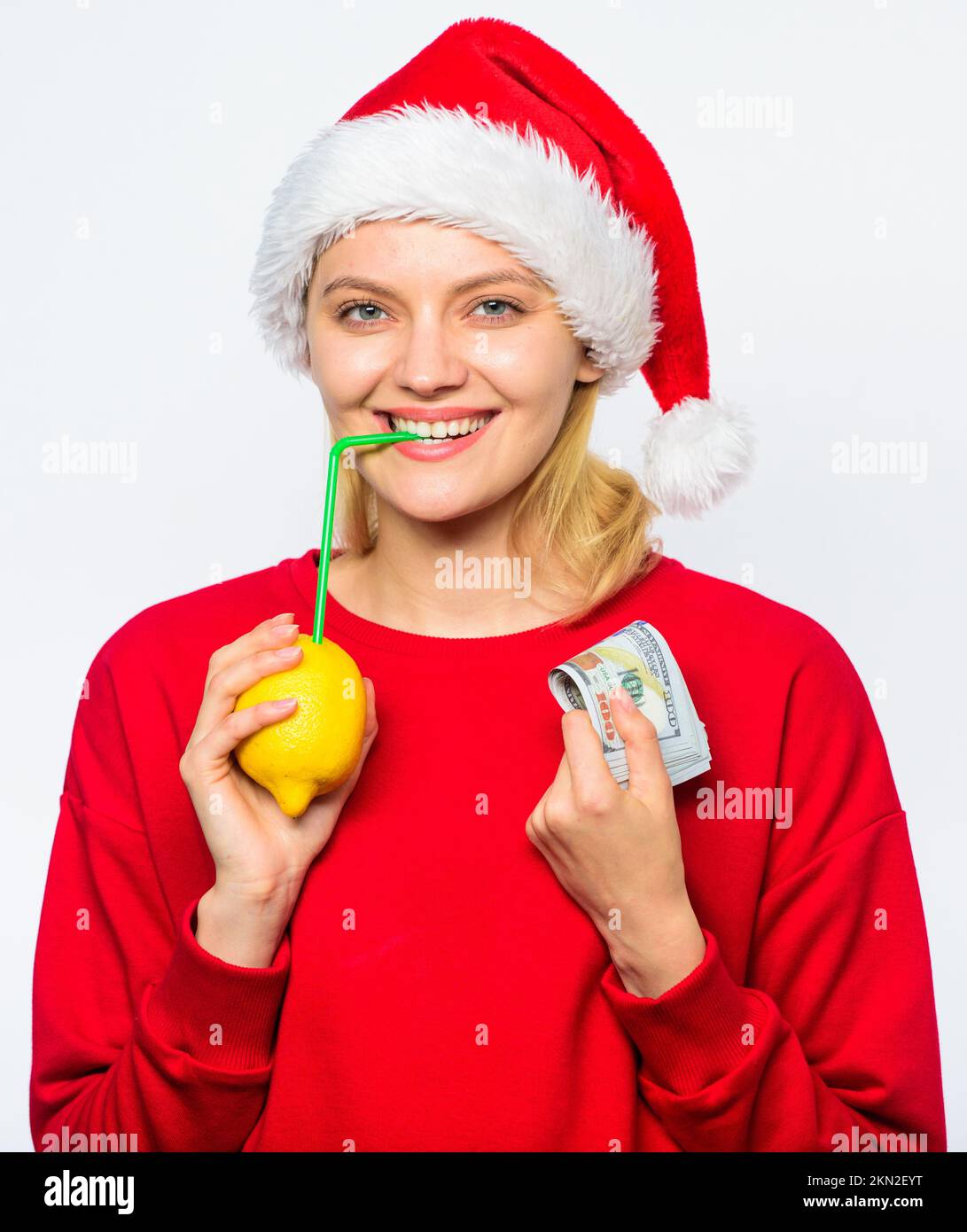 Christmas wishes. Rich girl with lemon and money. Woman lemon ...
