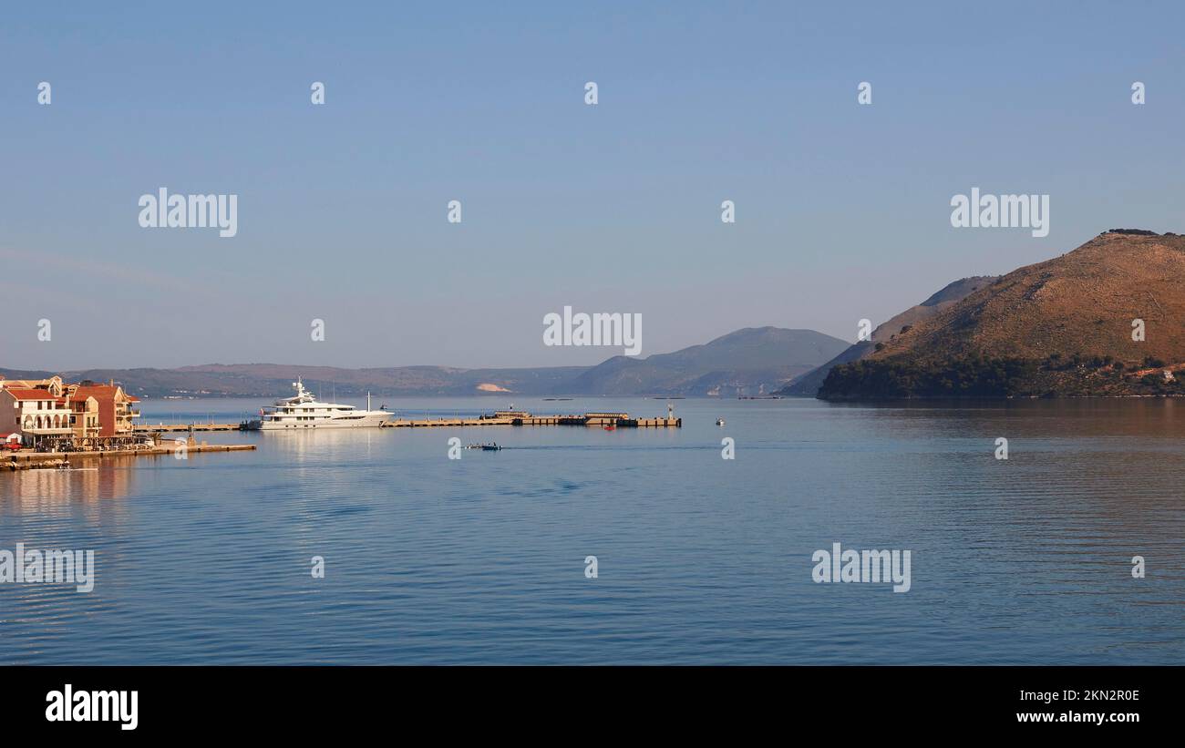 Argostoli, houses, jetty, luxury yacht, blue cloudless sky, Kefalonia ...