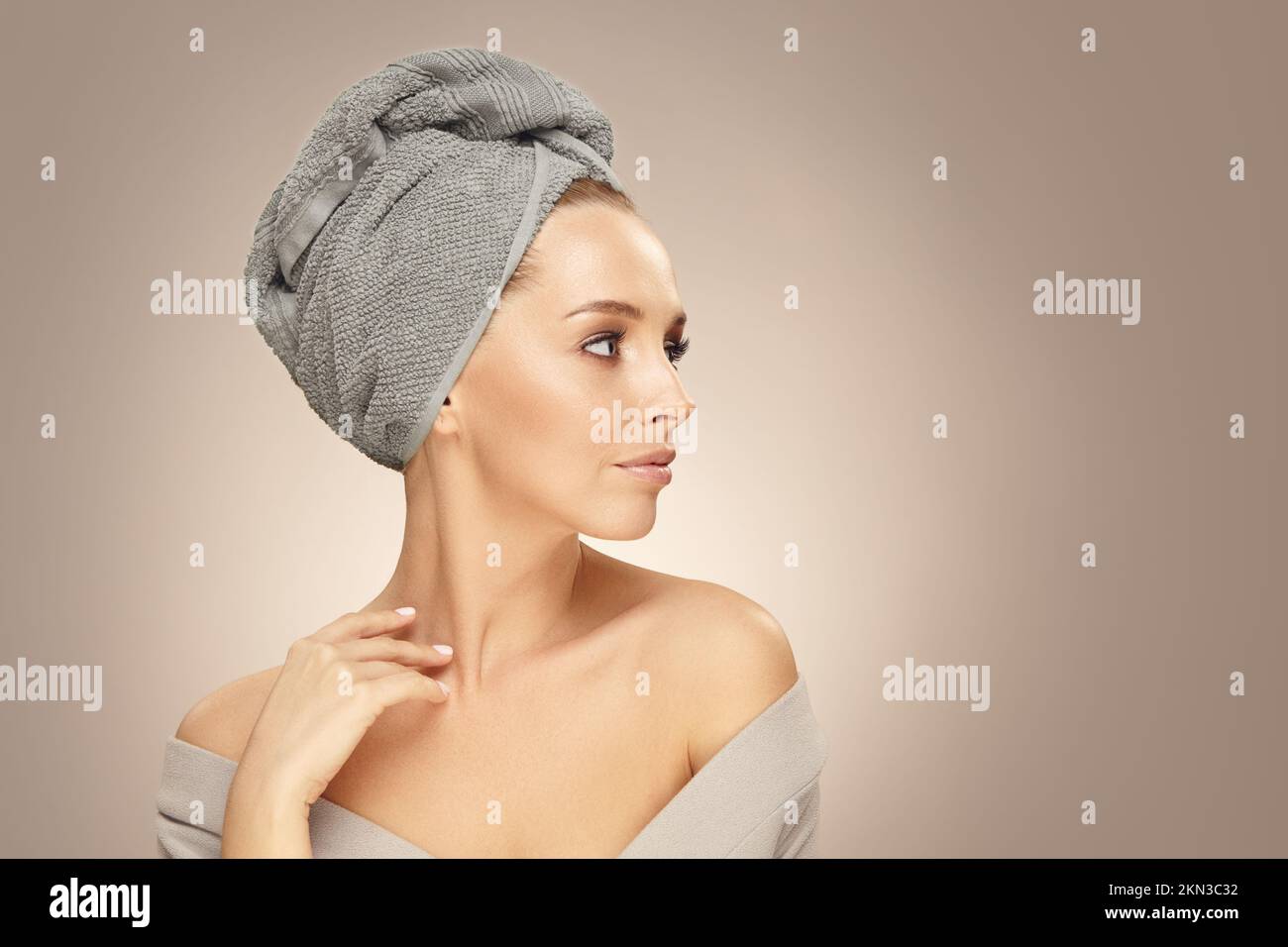 Beautiful woman with perfect skin after shower, wearing bathrobe and ...