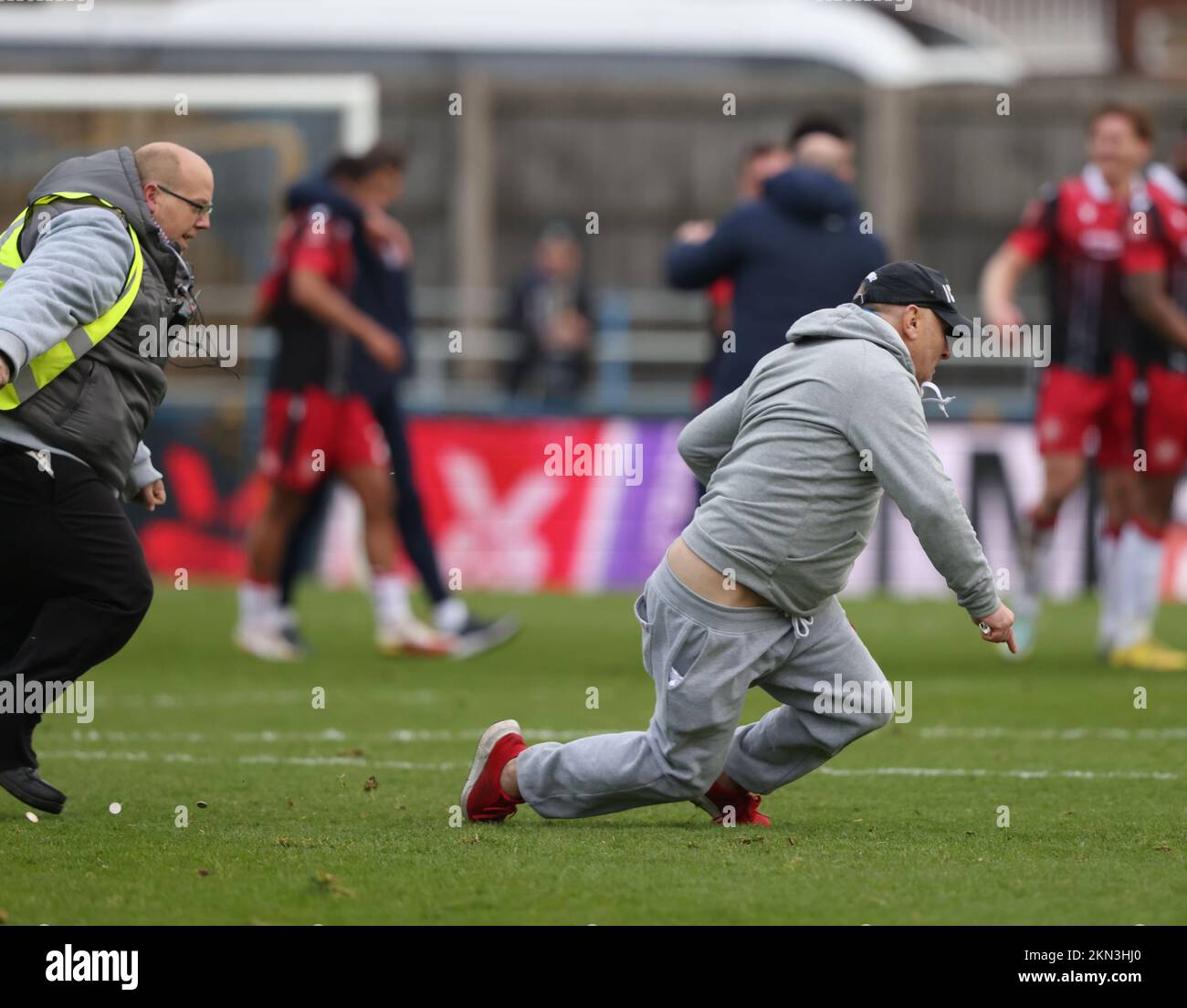 Kings Lynn, UK. 26th Nov, 2022. A pitch invader takes a tumble at the ...
