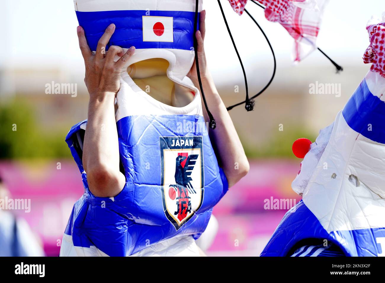 A Japan fan puts on their match day costume of the FIFA World Cup Group ...