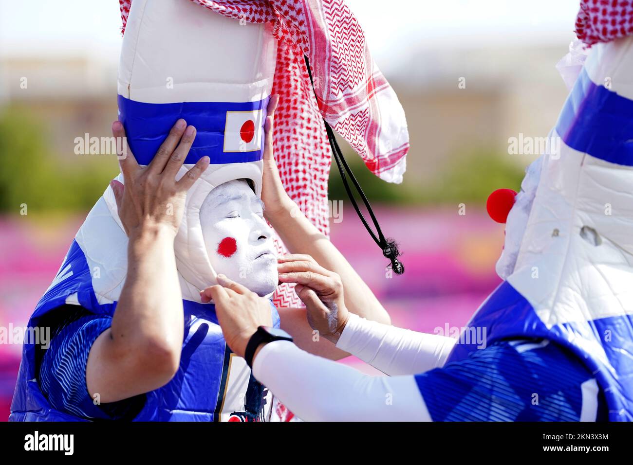 A Japan fan puts on their match day costume of the FIFA World Cup Group ...