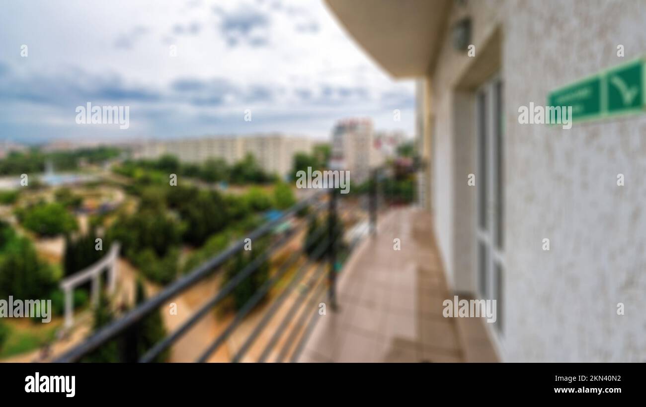 Abstract defocused city view with cloudy sky, view from high floor of ...