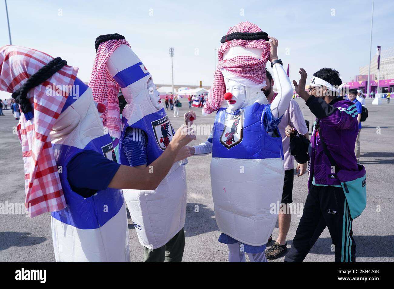 Japan fans apply face paint to complete their match day attire, ahead ...
