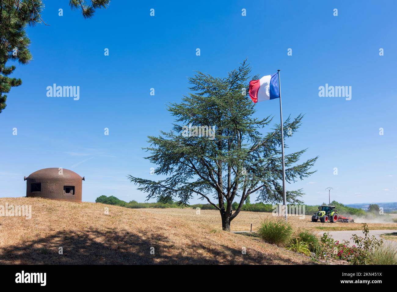 : bunker from WWII, French flag, field, tractor in Lorraine (Lothringen ...