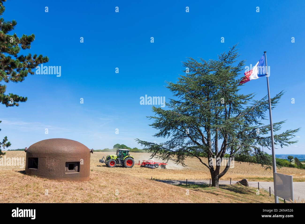 : bunker from WWII, French flag, field, tractor in Lorraine (Lothringen ...