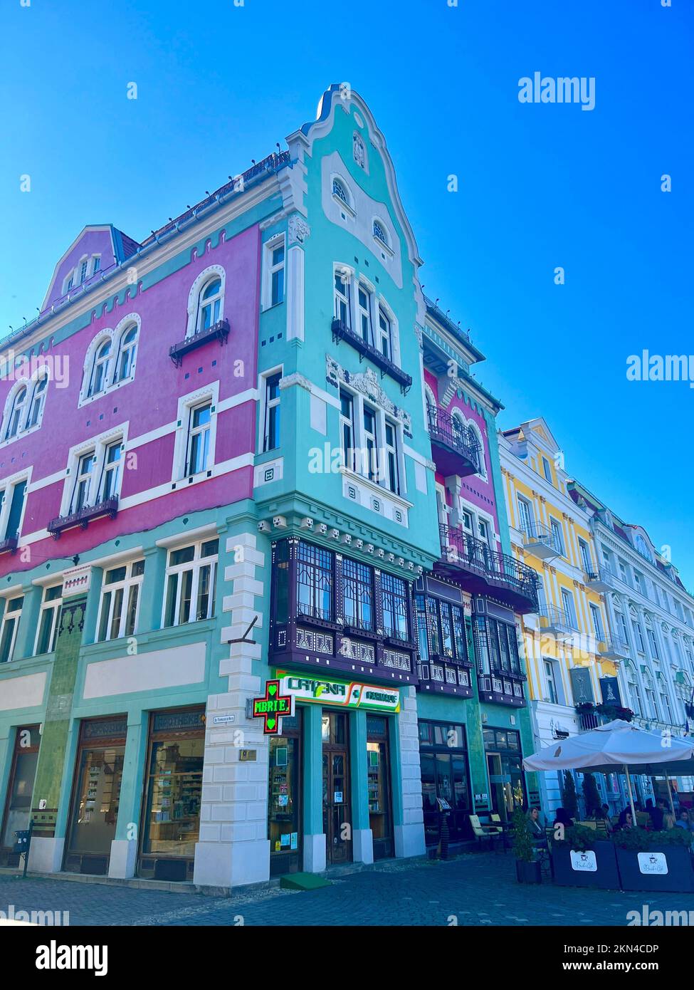 A vertical shot of colorful Union square buildings in Timisoara ...
