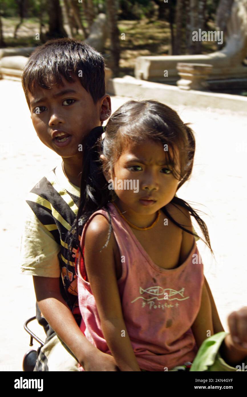 Children playing at the beginning of the causeway, Boeng Mealea Temple ...