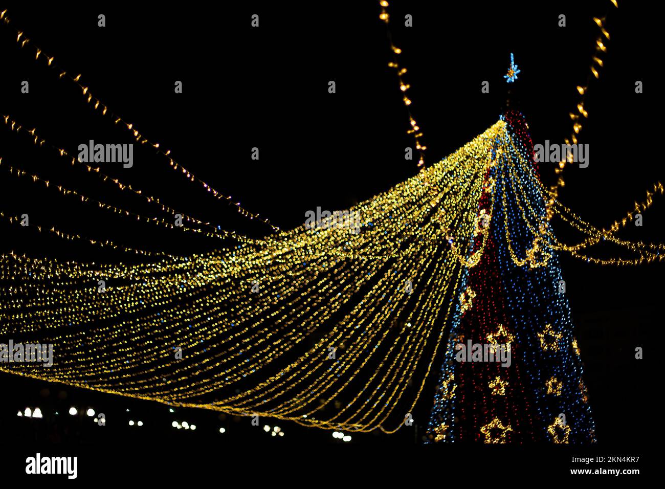 Long exposure night shot of a uniquely decorated main Christmas tree in ...