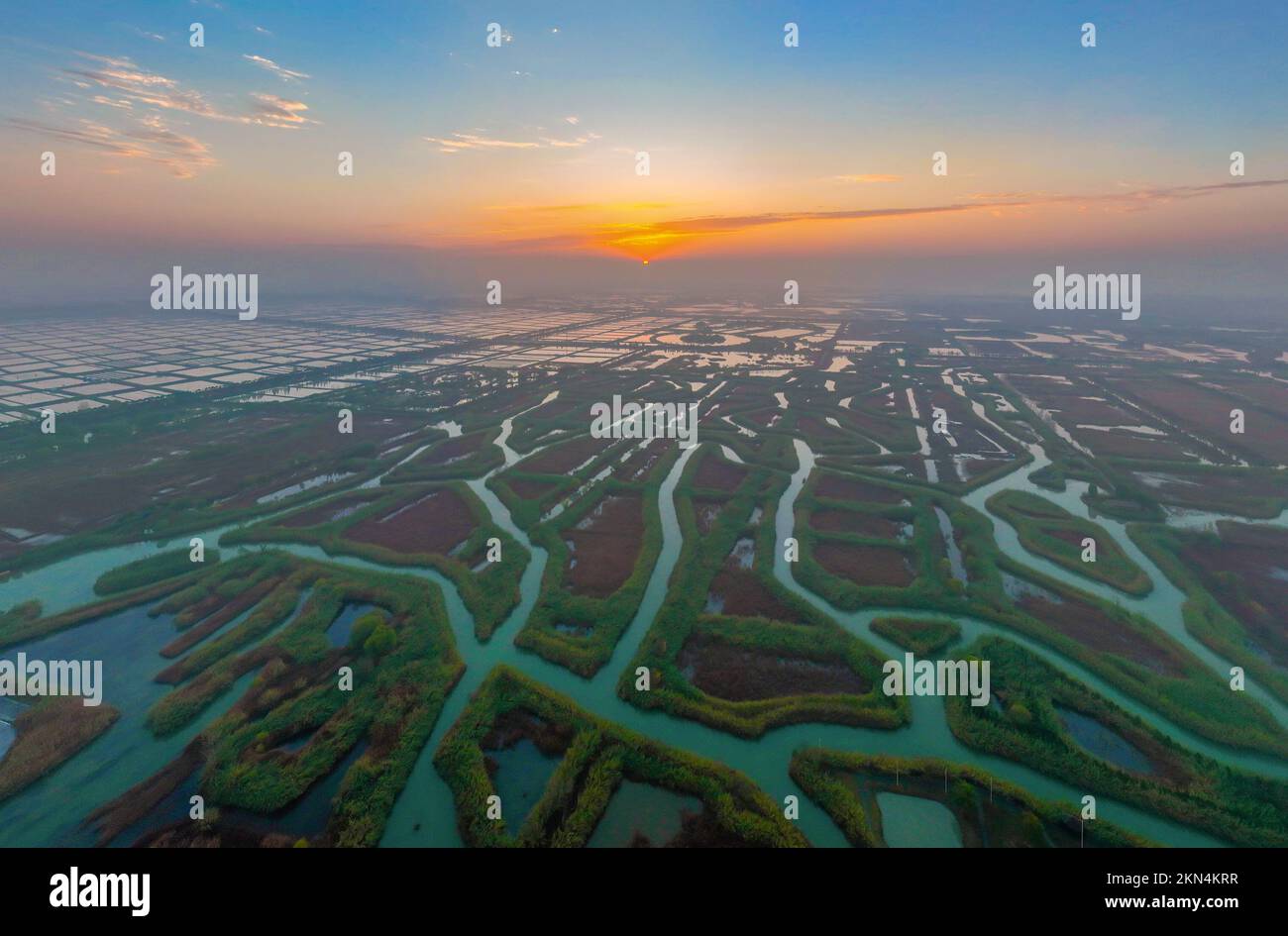 SUQIAN, CHINA - NOVEMBE 25, 2022 - Aerial photo shows the winding reed ...