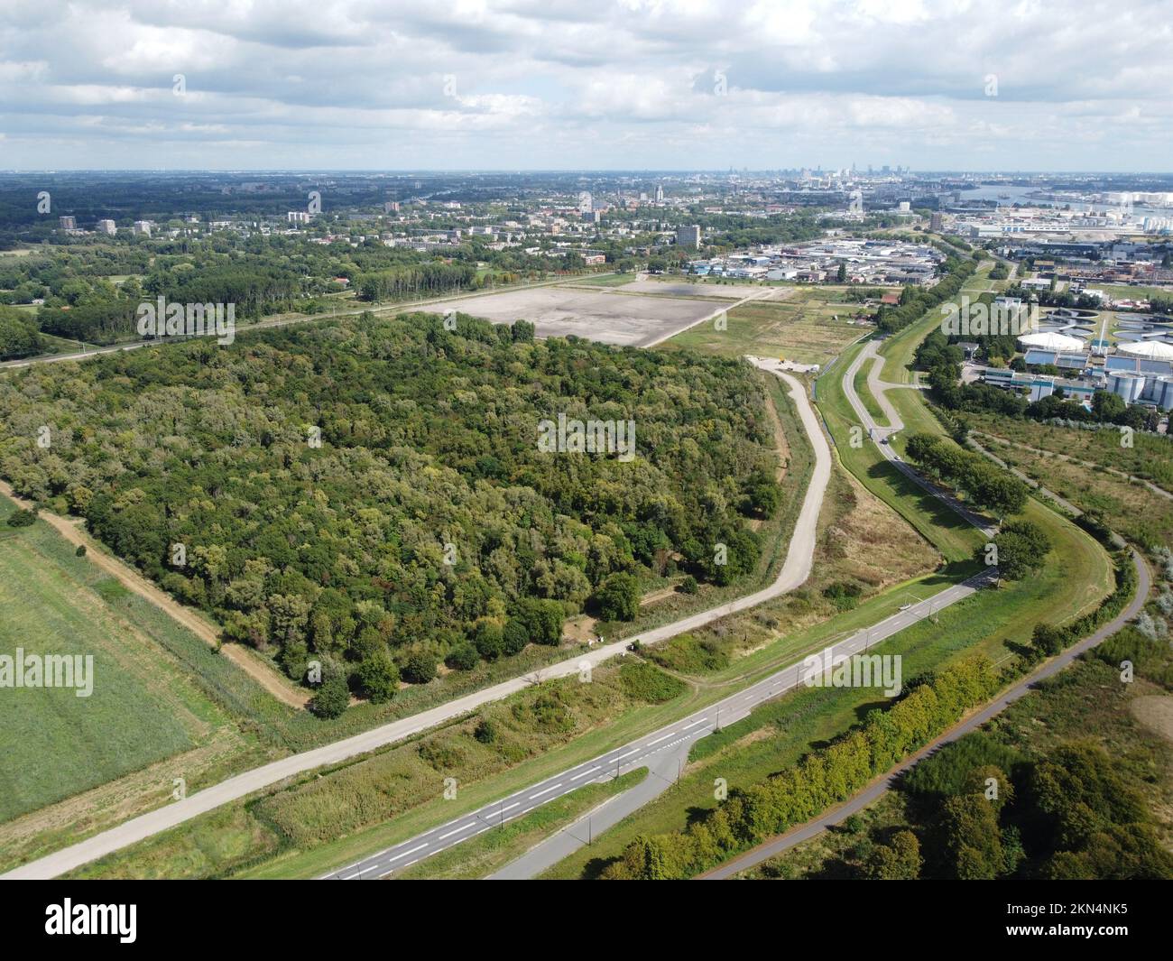 An aerial view of agricultural fields in a rural area in the morning ...