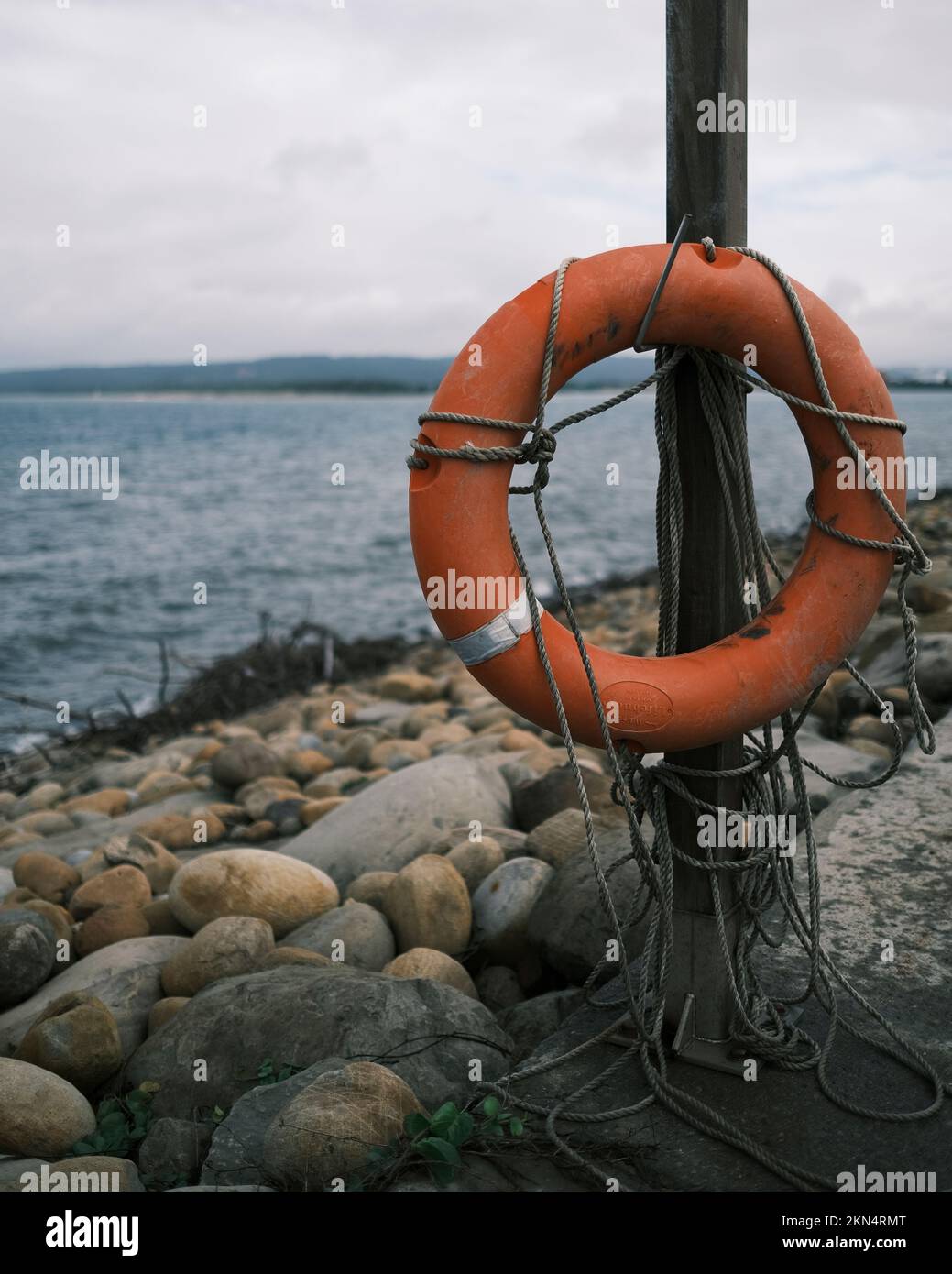 Life guard ring at the seaside Stock Photo - Alamy