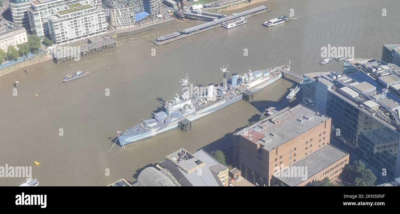 An aerial view of the HMS Belfast town-class light cruiser in the water ...