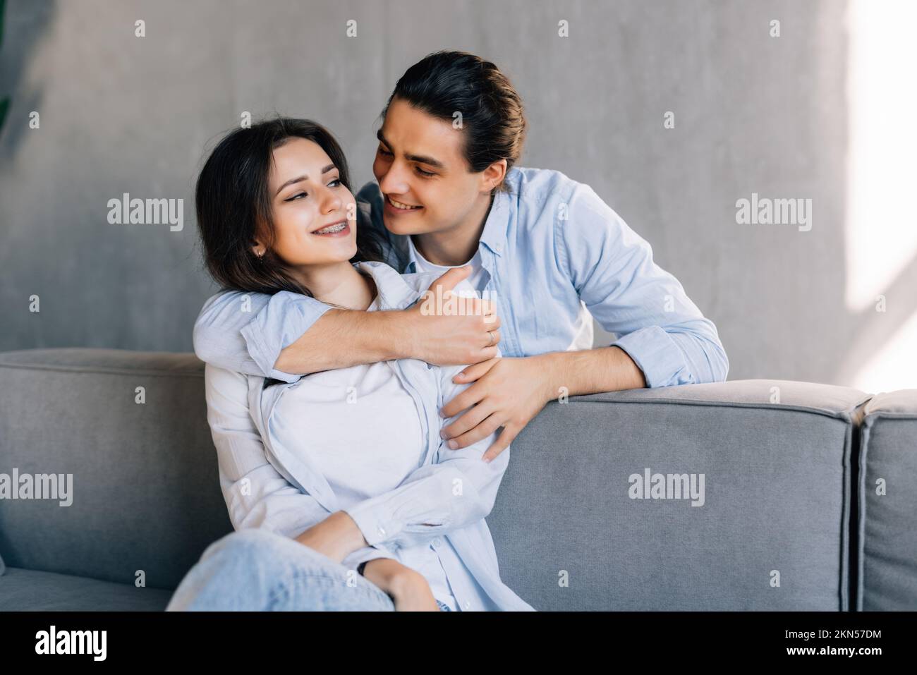 Loving husband comfort upset offended wife, caressing and hugging her ...