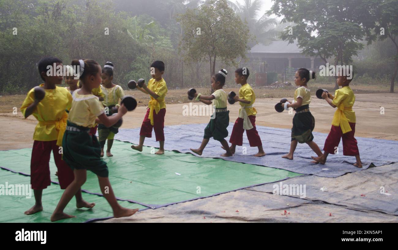 Children doing the coconut shell dance, Vat Luong, Pursat Province ...